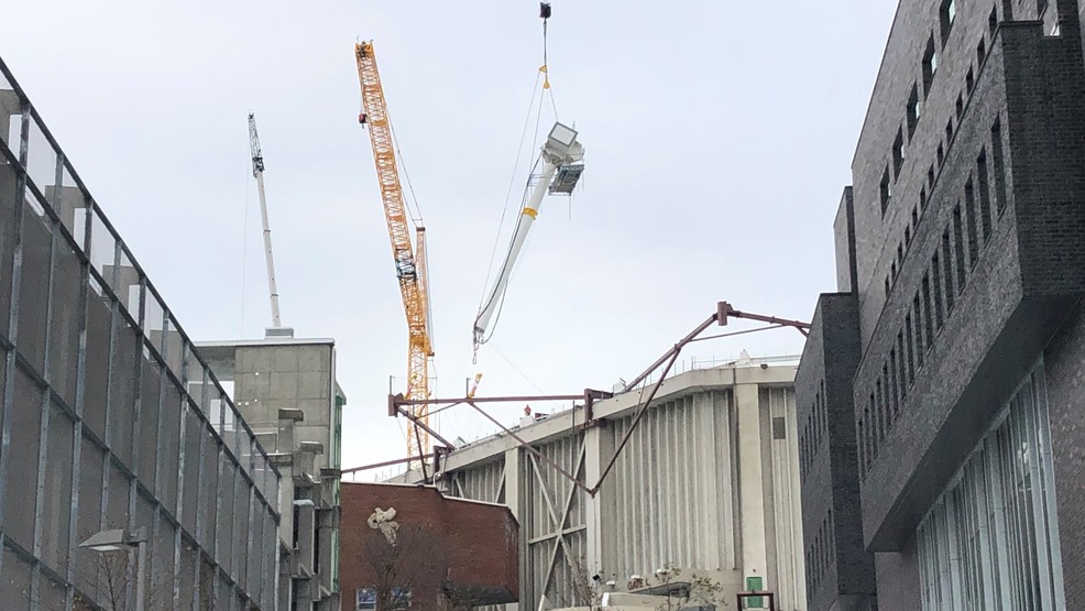 Dome roof construction begins with first pieces of 'crown truss' put in ...